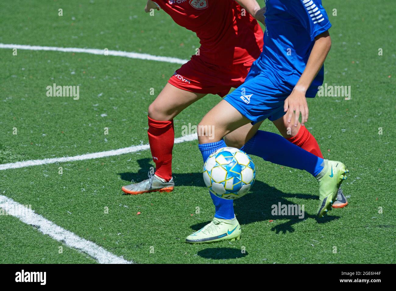 Girls football players equipped with Nike and Select sport equipment ...