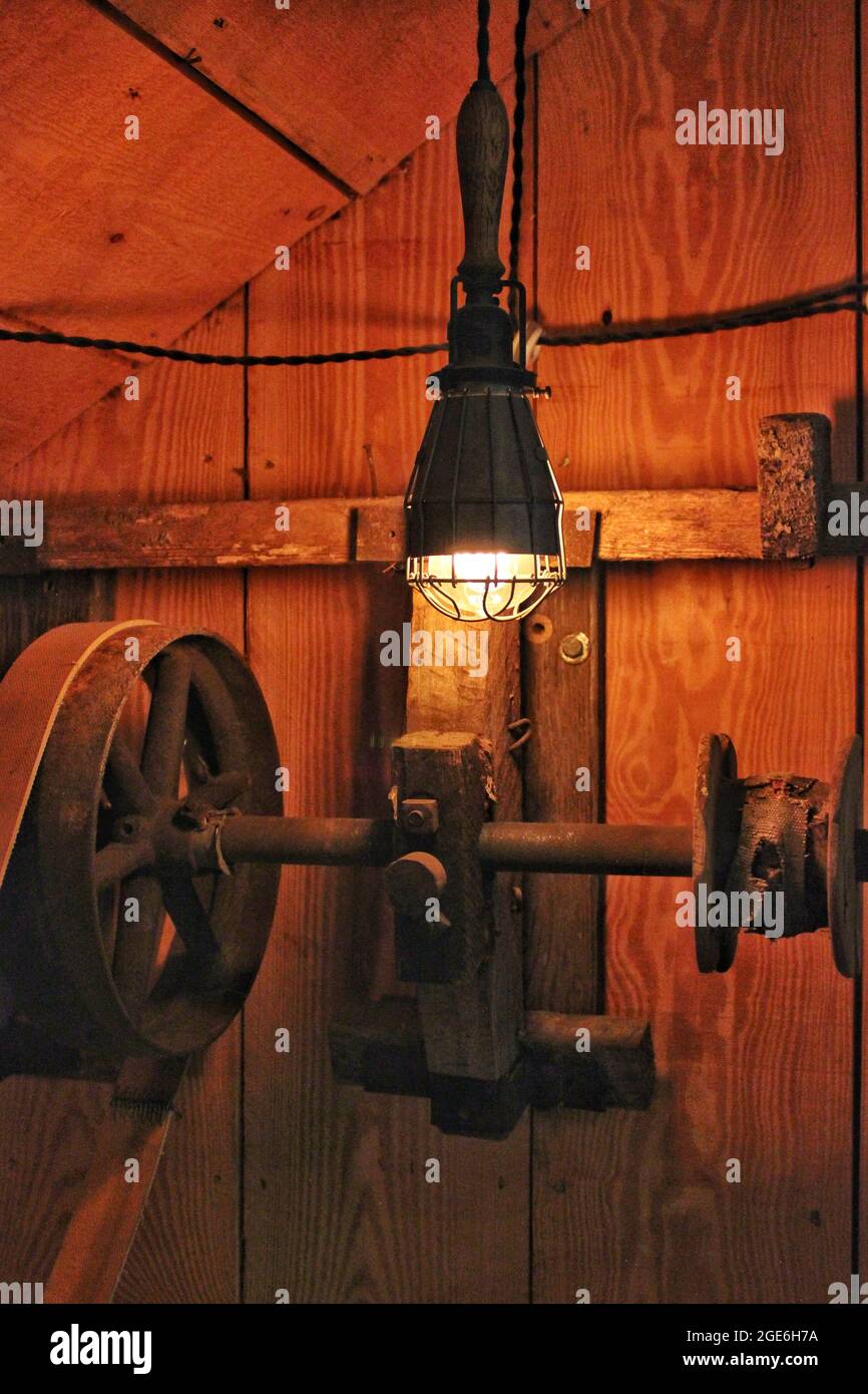 Old tool shed with vintage tools and a dim light Stock Photo - Alamy