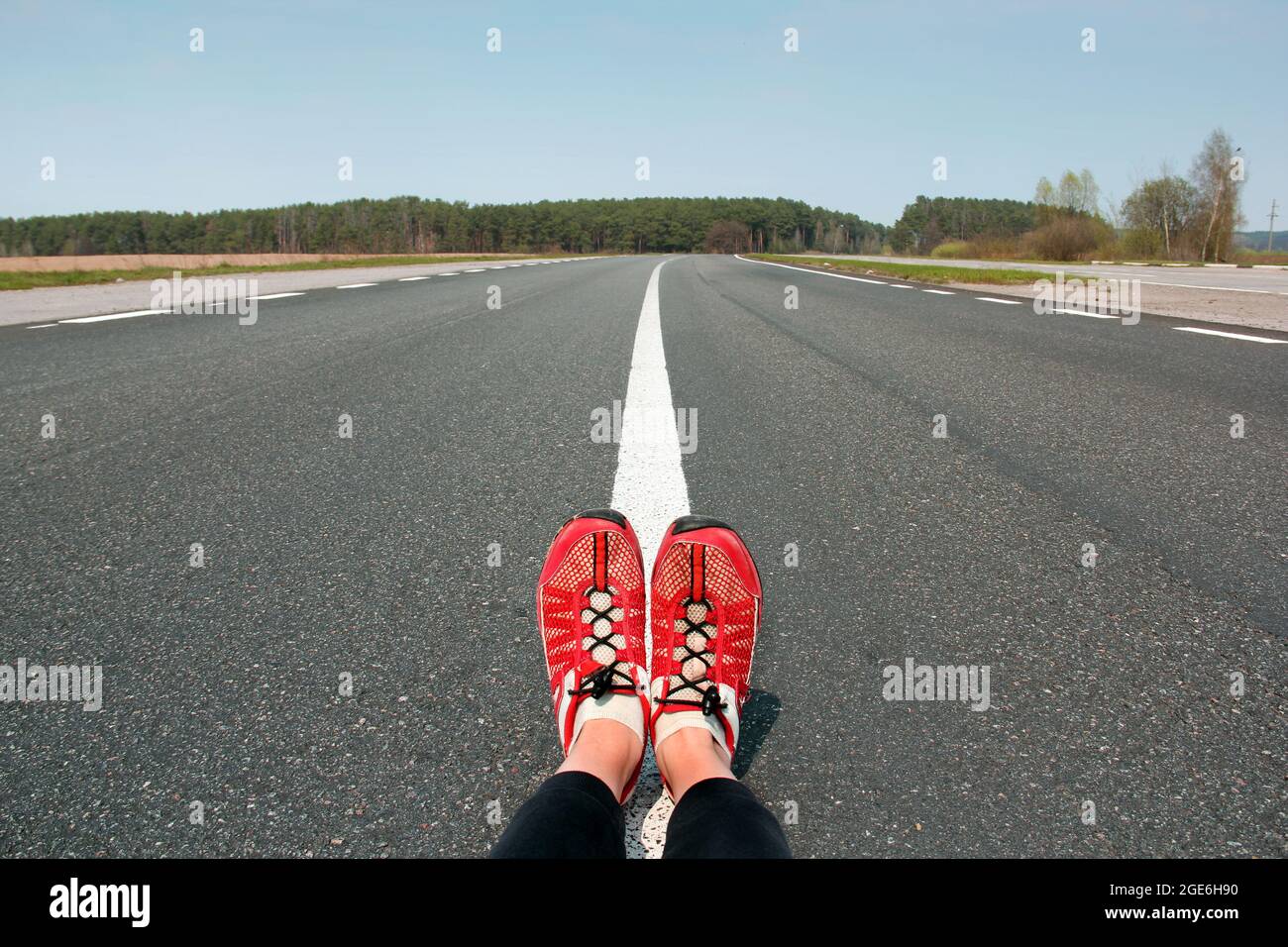 Beautiful road and female legs hi-res stock photography and images - Alamy