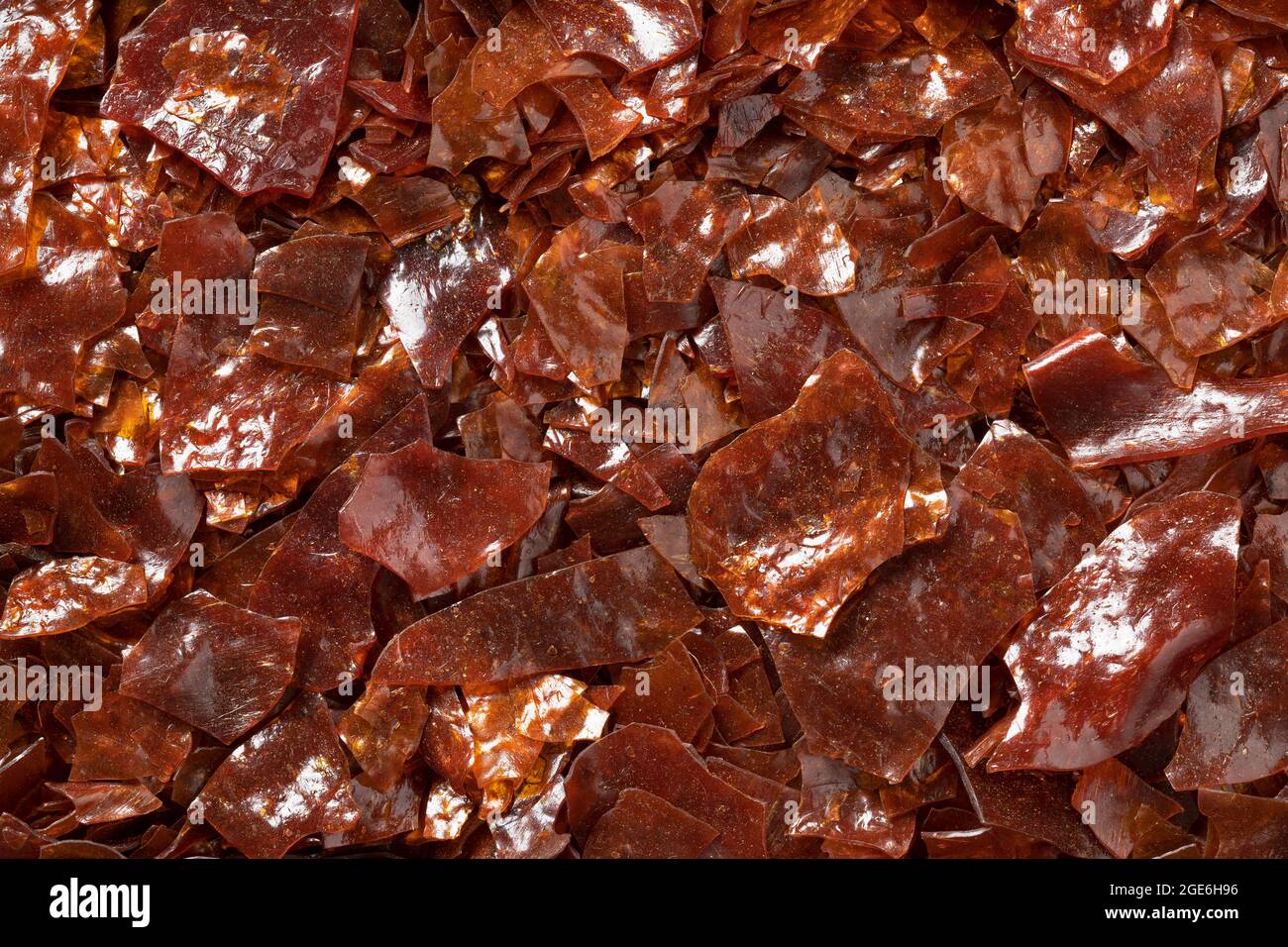 Brown Shellac dry flakes close up full frame as background Stock Photo - Alamy