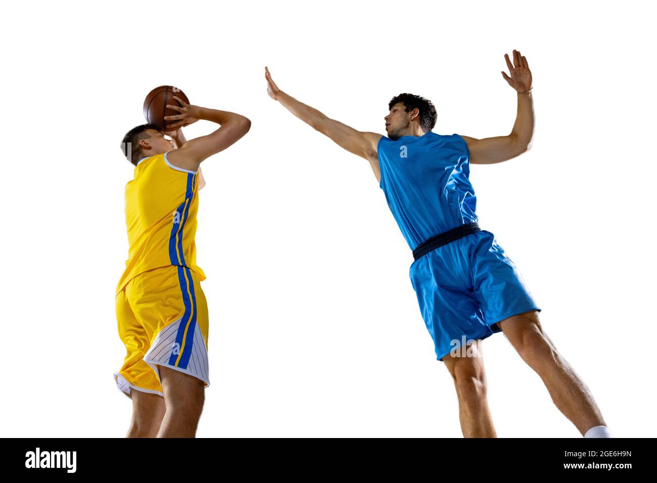Two male athletes, basketball players in action, motion compete during ...