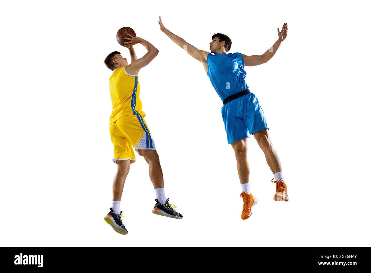Two male athletes, basketball players in action, motion compete during ...