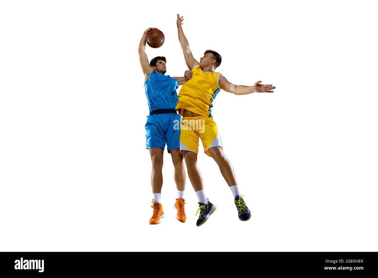 Two male athletes, basketball players in action, motion compete during ...