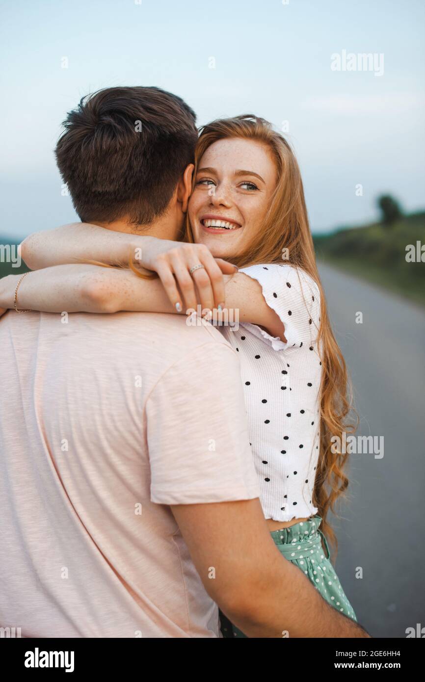 Portrait of red haired woman embracing lover. Beautiful female person ...