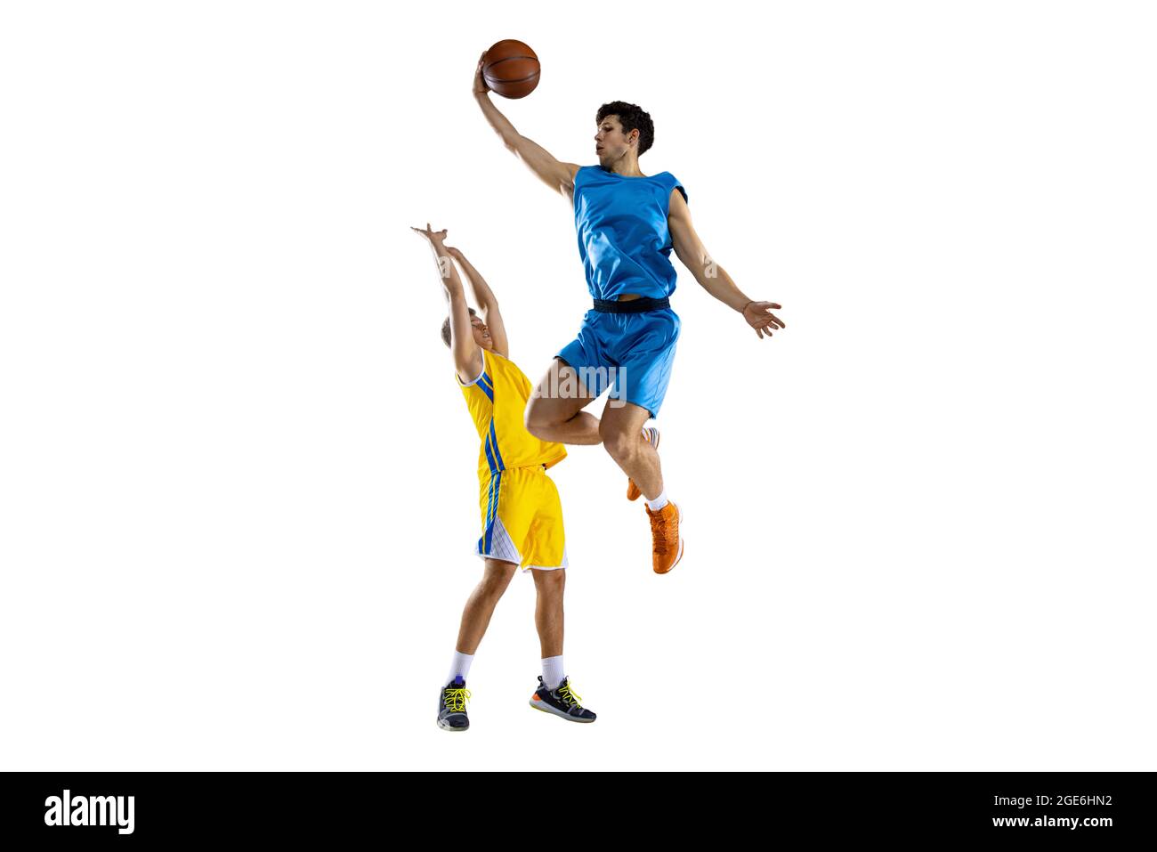 Two male athletes, basketball players in action, motion compete during ...