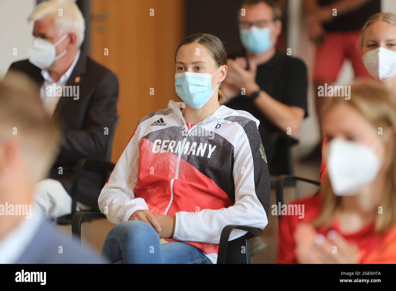Magdeburg, Germany. 17th Aug, 2021. Olympic athlete Sarah Köhler (M) is ...