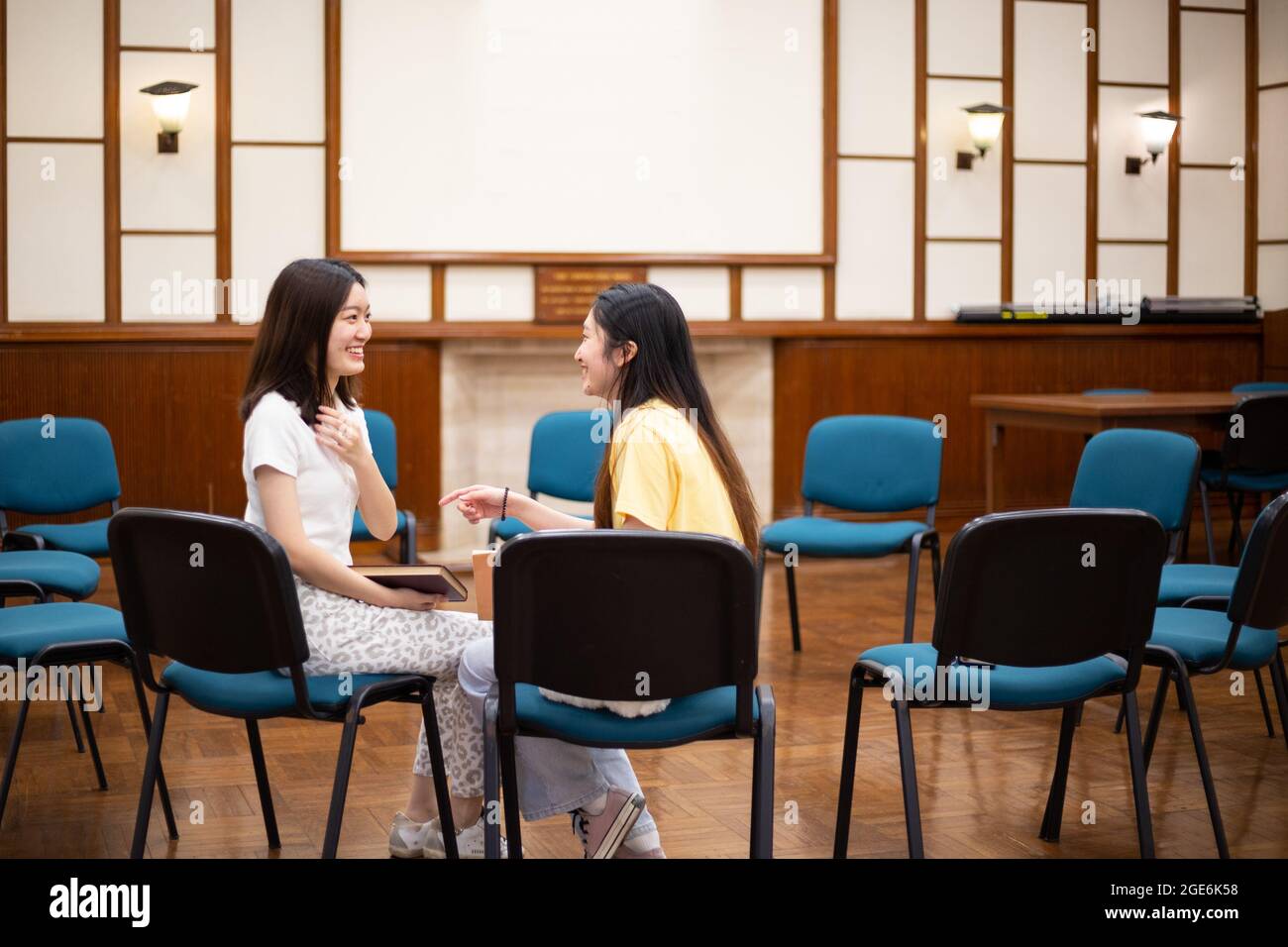 happy, cheerful, stylish Female university students chat with each ...