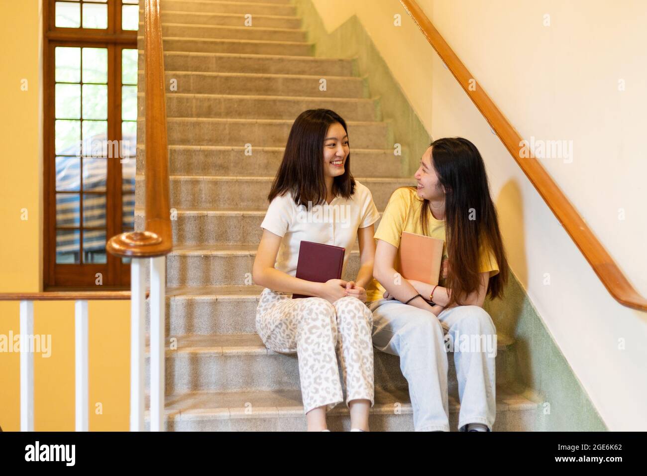 happy, cheerful, stylish Female university students chat with each ...