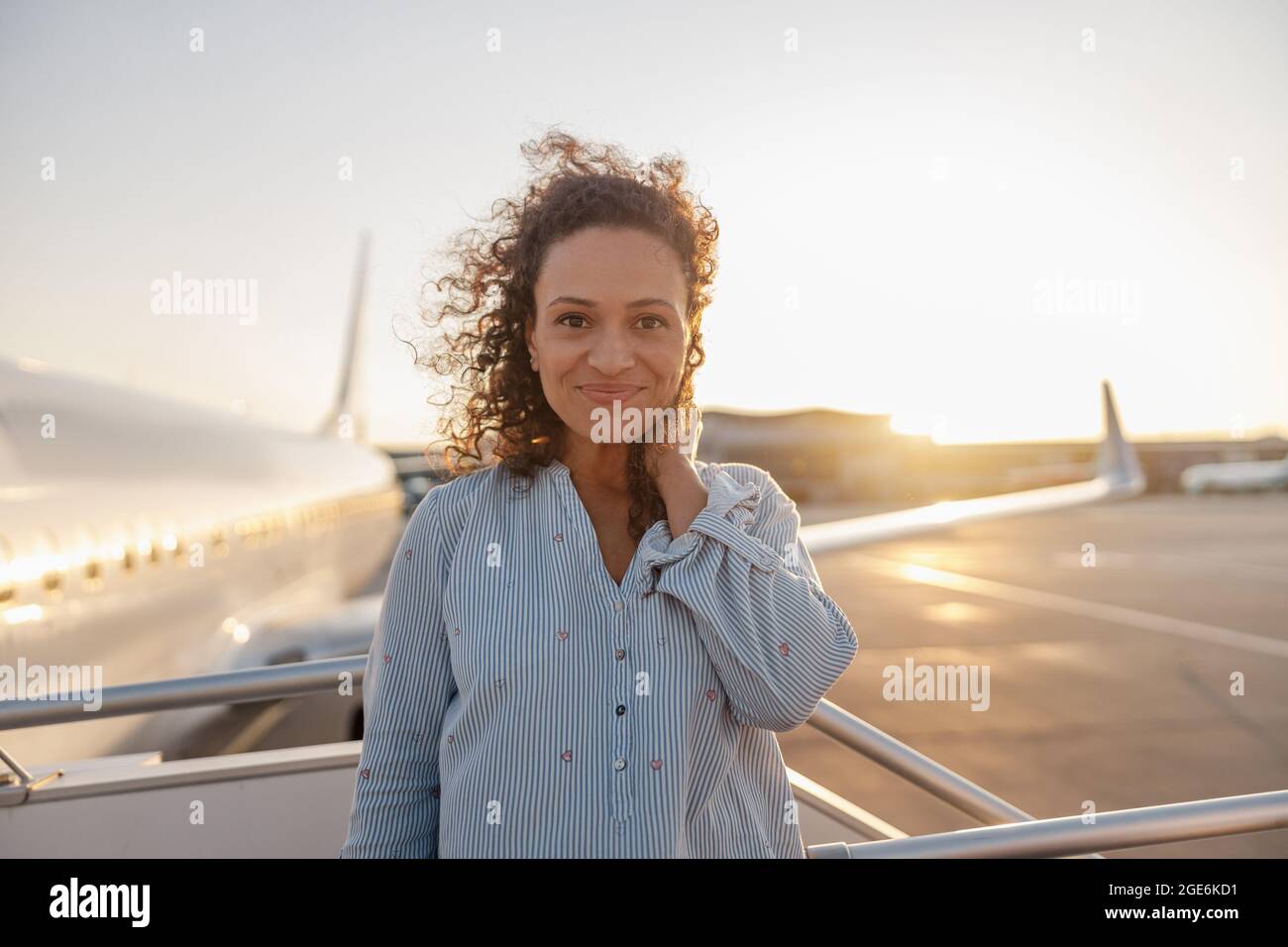 Woman boarding plane hi-res stock photography and images - Alamy