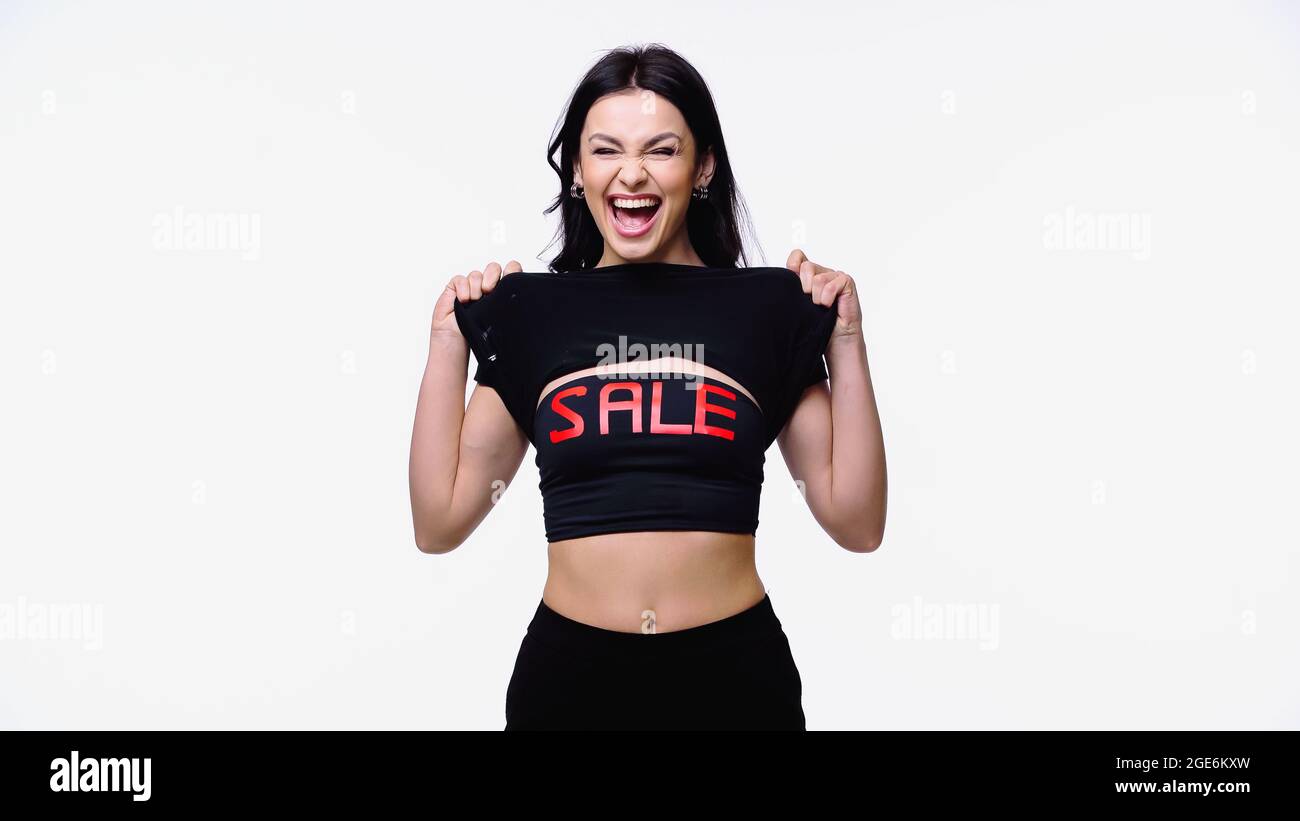 Excited woman showing top with sale lettering isolated on white Stock ...