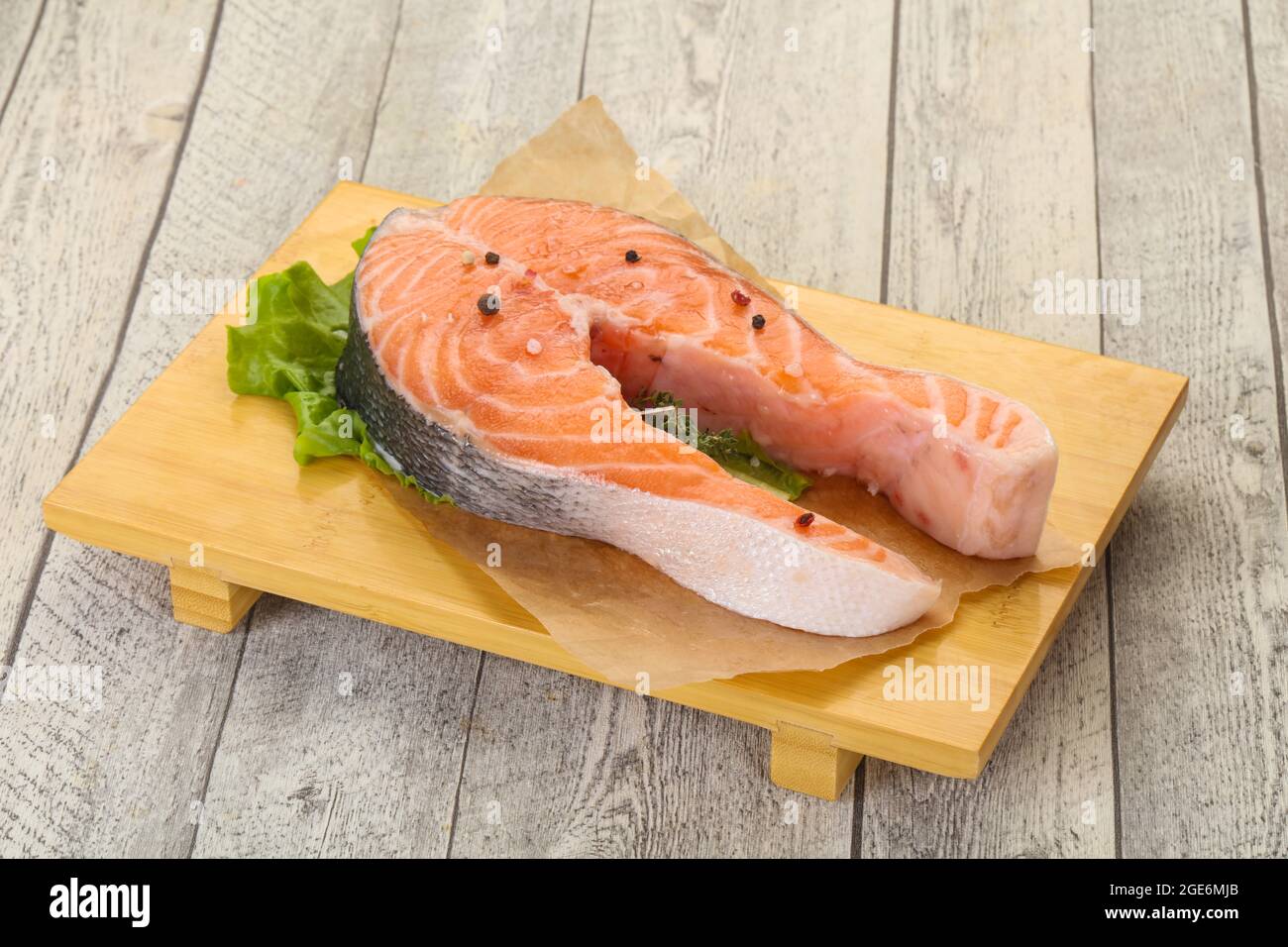Raw salmon steak with salt and pepper - ready for grill Stock Photo - Alamy