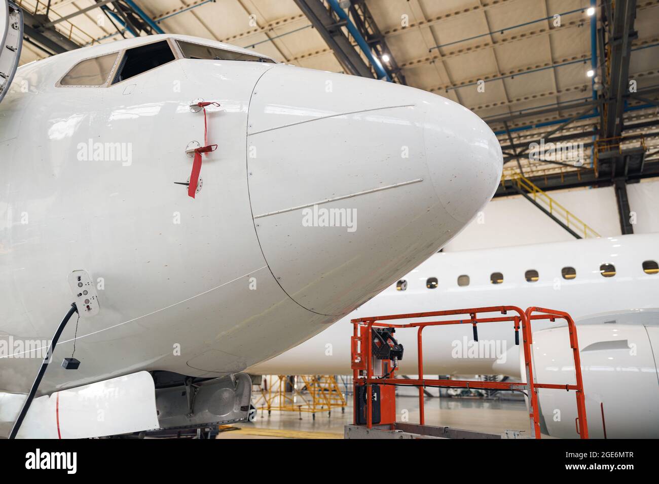Close up shot of fuselage of modern passenger airplane on maintenance ...