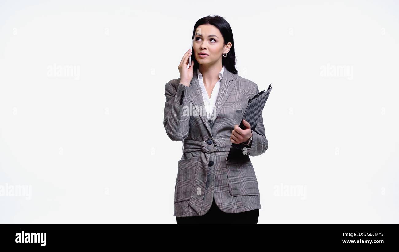 Manager talking on mobile phone and holding clipboard isolated on white ...