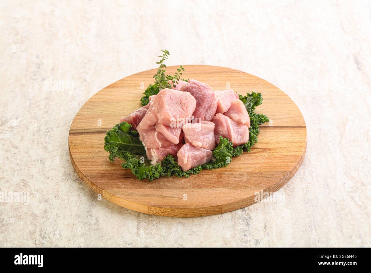 Raw pork meat cubes for coocking over board Stock Photo - Alamy