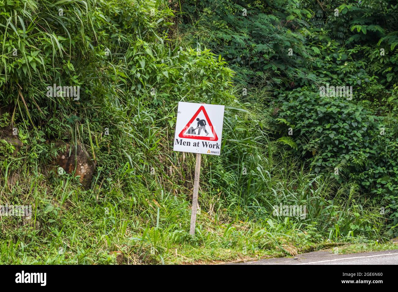 Men at Work Sign at Roadside Stock Photo - Alamy