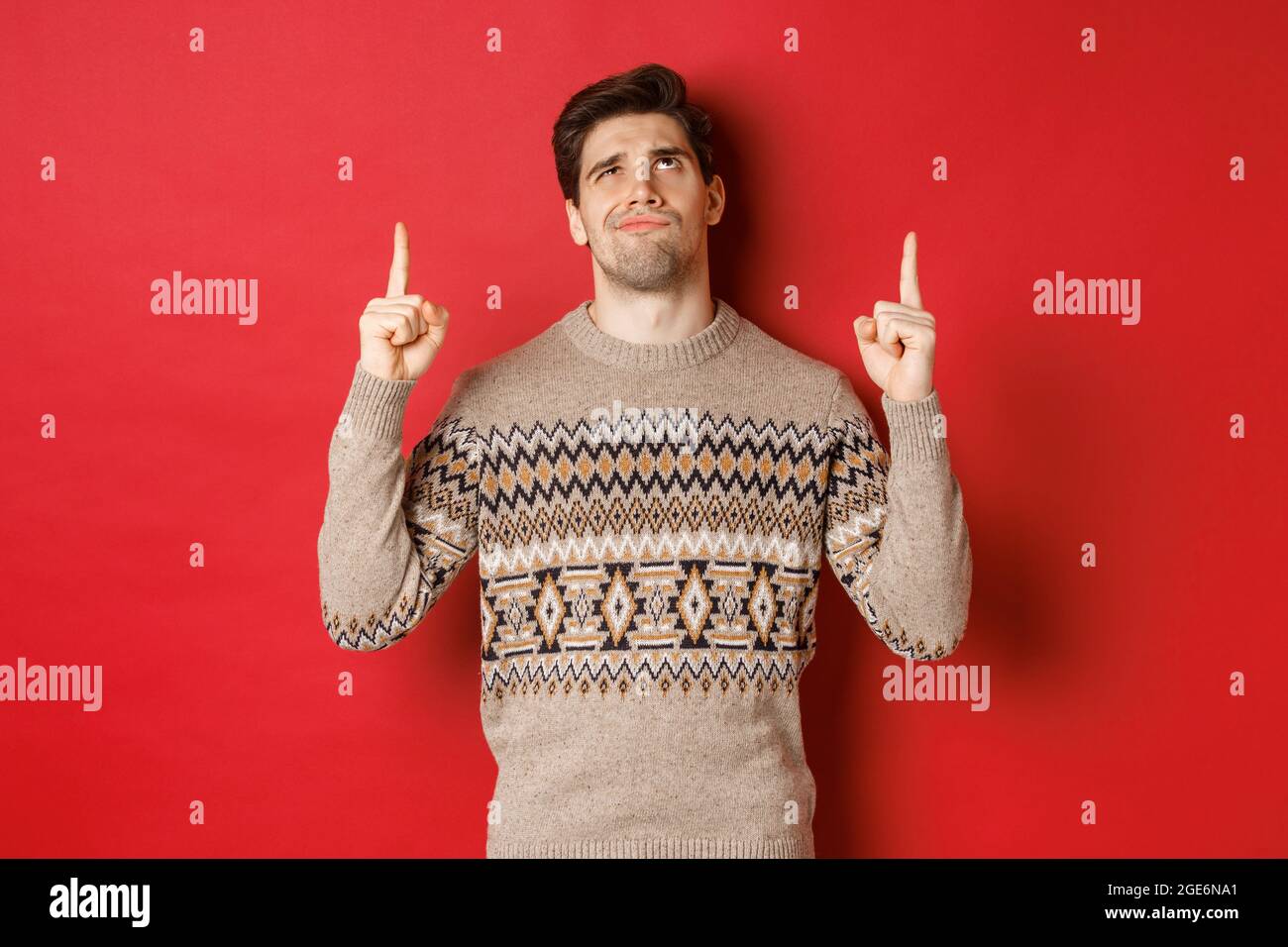 Image of disappointed and skeptical handsome man, wearing christmas ...