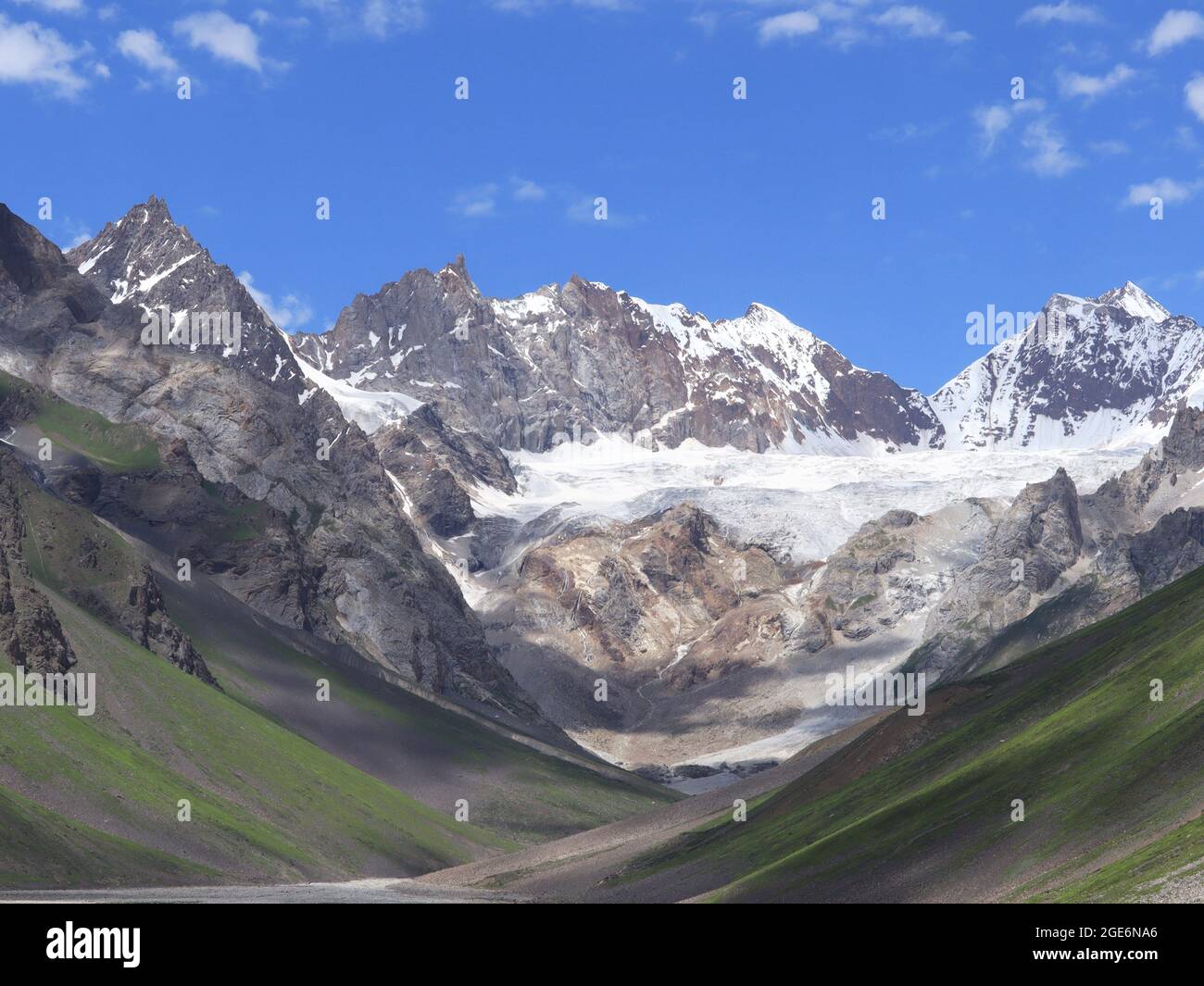 A mini glacier between mountains and sky Stock Photo - Alamy