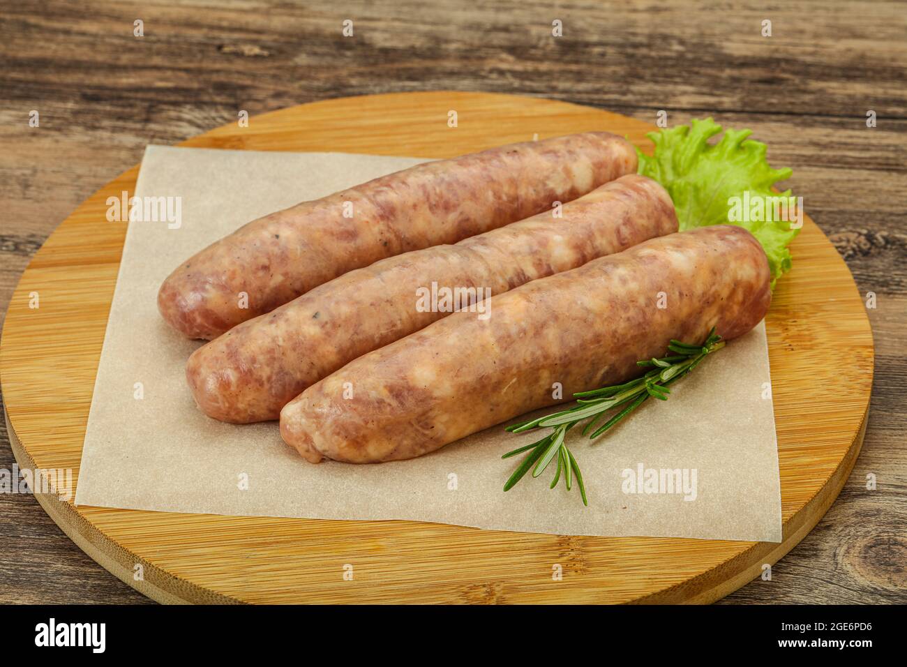 Raw pork meat sausages for grill served rosemary Stock Photo - Alamy