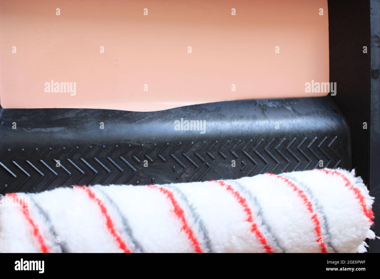 Preparing to paint the wall with brush, paint and roller brush. Top ...