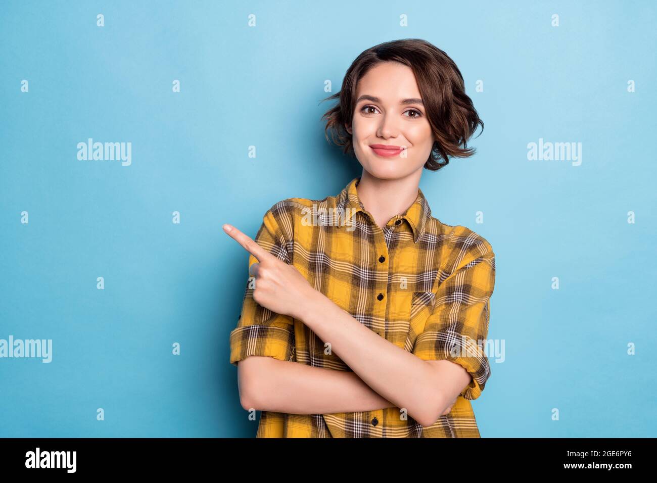 Photo of confident lady indicate forefinger empty space promoting ...