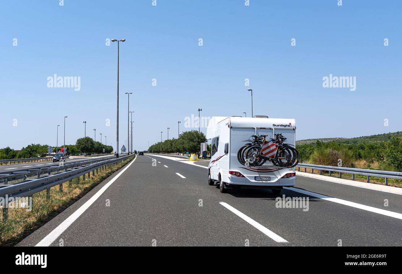 Tourists car with bicycles on the motorway in the city of Zadar ...