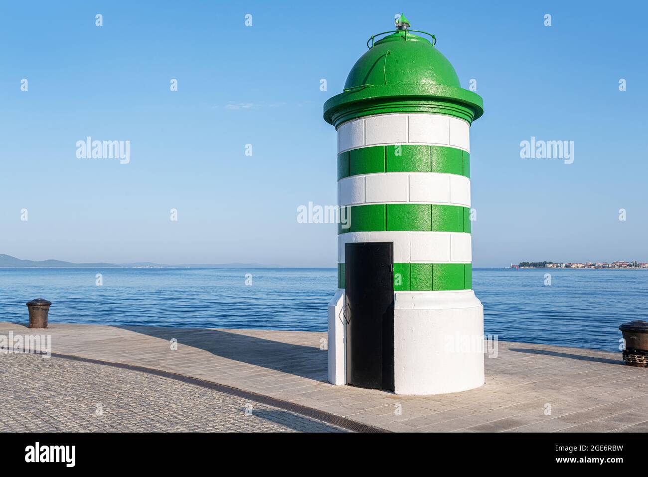 Small green lighthouse on the waterfront. Zadar, Croatia Stock Photo - Alamy