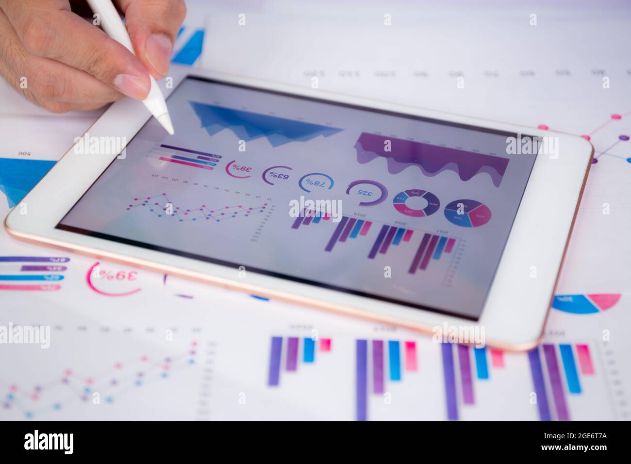 Businessman planning about graph and chart of investment with report ...
