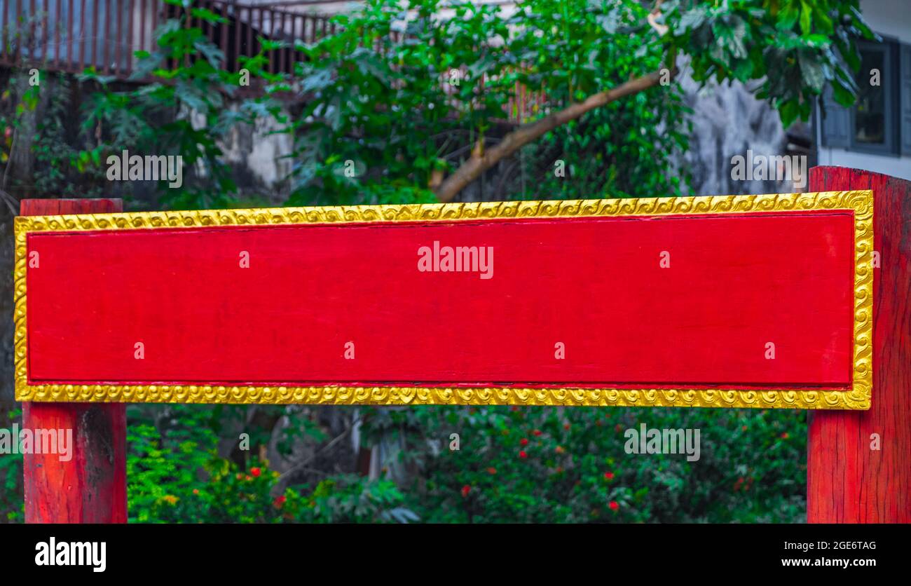 Empty blank red gold welcome sign to wat buddhist temple in Luang ...