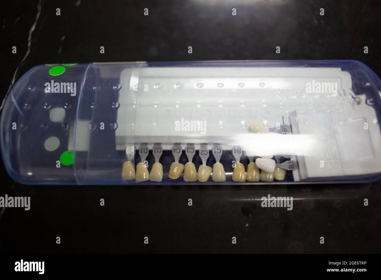 Palette of shades of teeth at a dentist office. Dental color samples ...