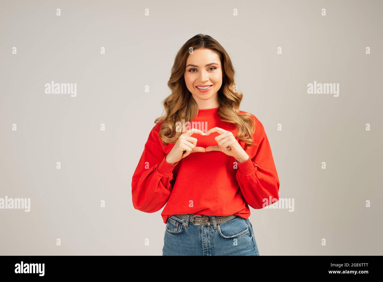 Woman showing heart sign hi-res stock photography and images - Alamy