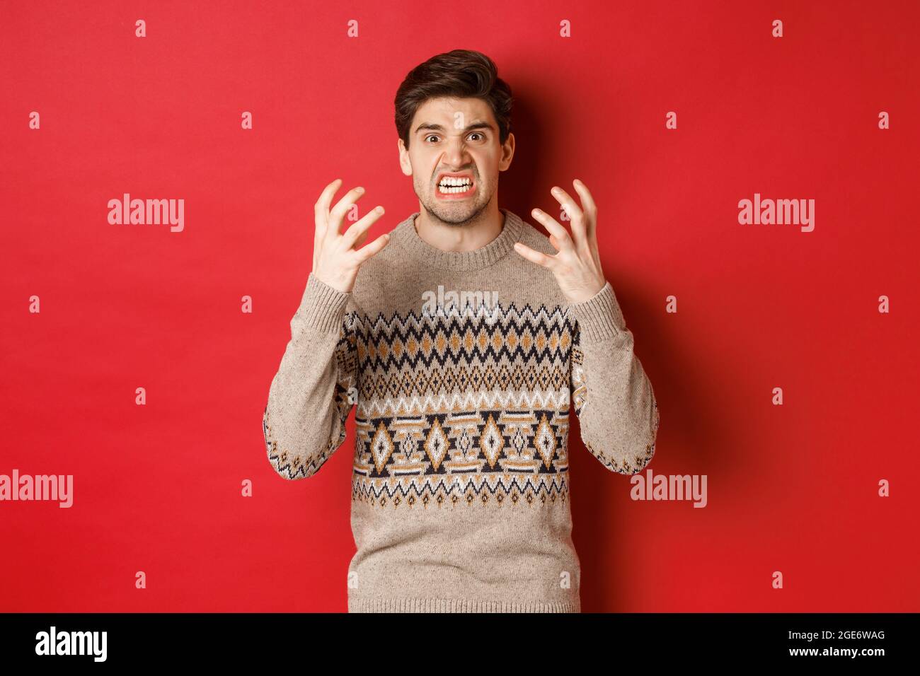 Image of angry and frustrated man in winter sweater, shouting and ...