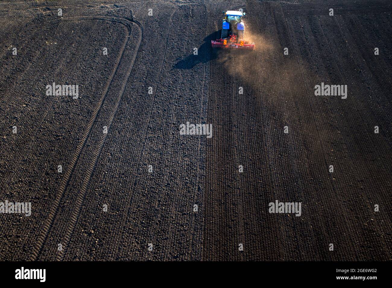 Aerial view of the mechanical preparation of a land in the autumn ...