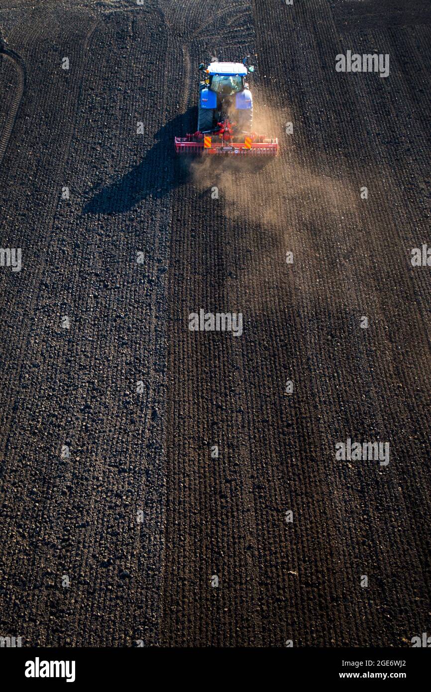 Aerial view of the mechanical preparation of a land in the autumn ...