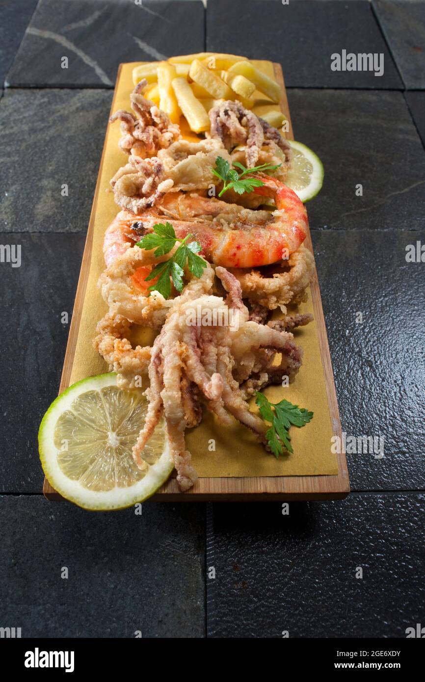 Presentation of a second dish based on fried fish with potatoes Stock ...