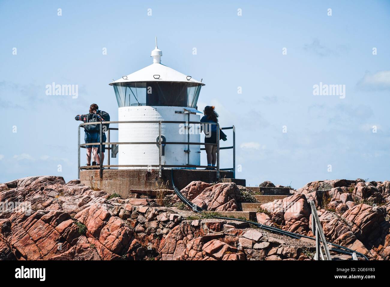 Photo of a lighthouse at the sea with people in Stock Photo - Alamy