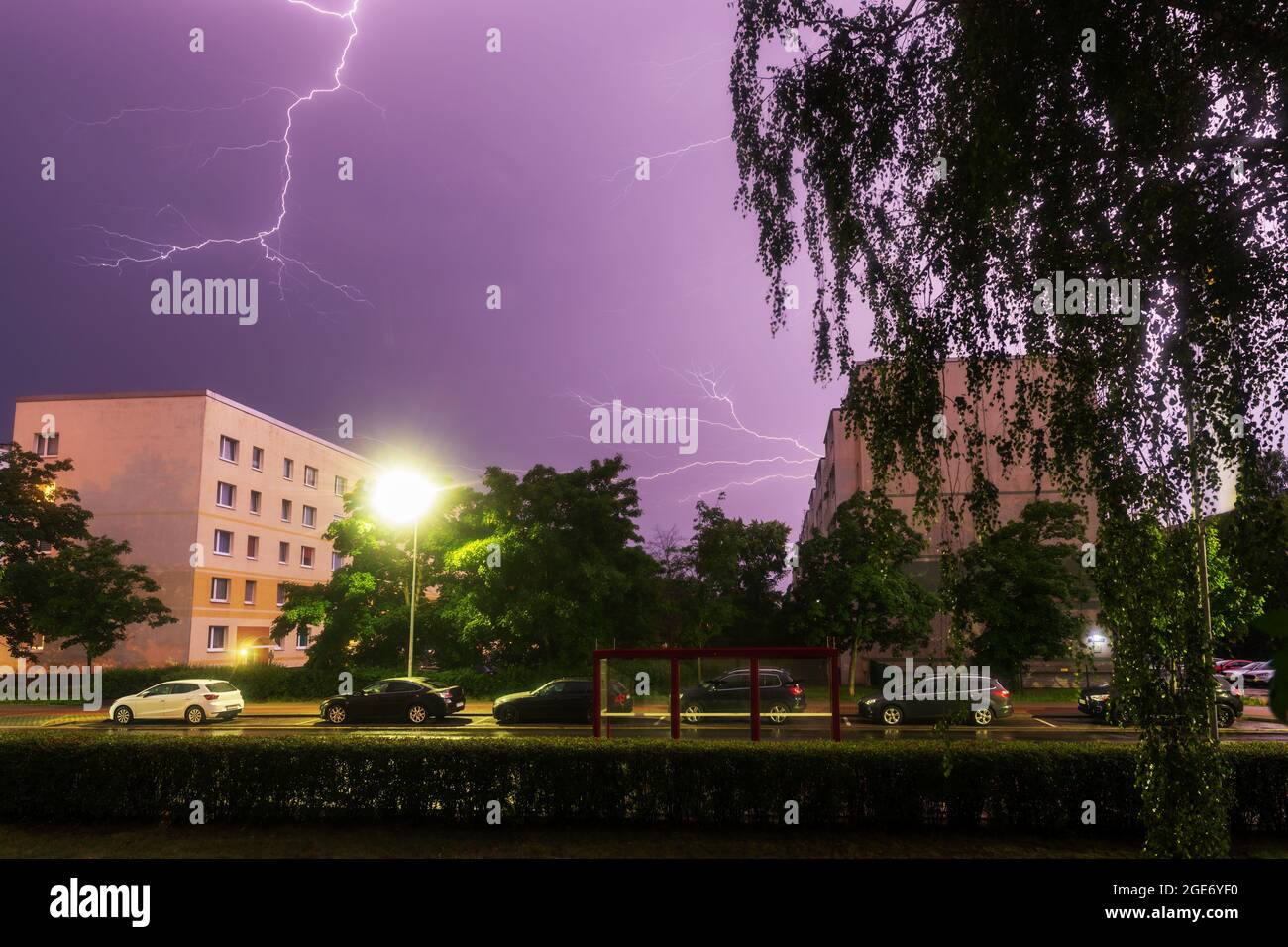 A thunderstorm with lightning passes over a city in the night Stock ...