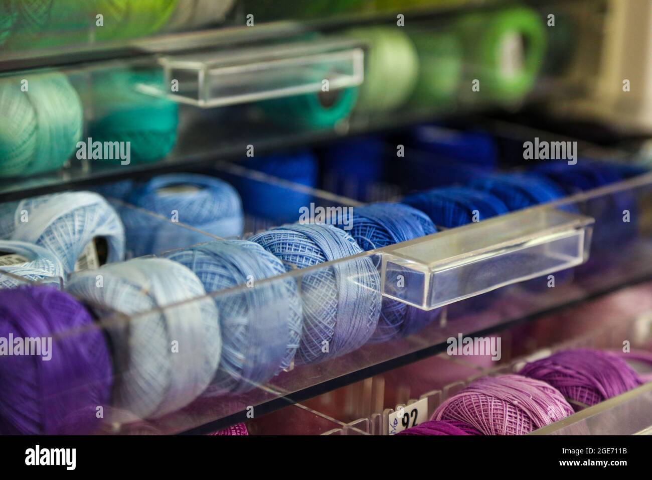 View of drawers and yarn displays of various colors and various types ...