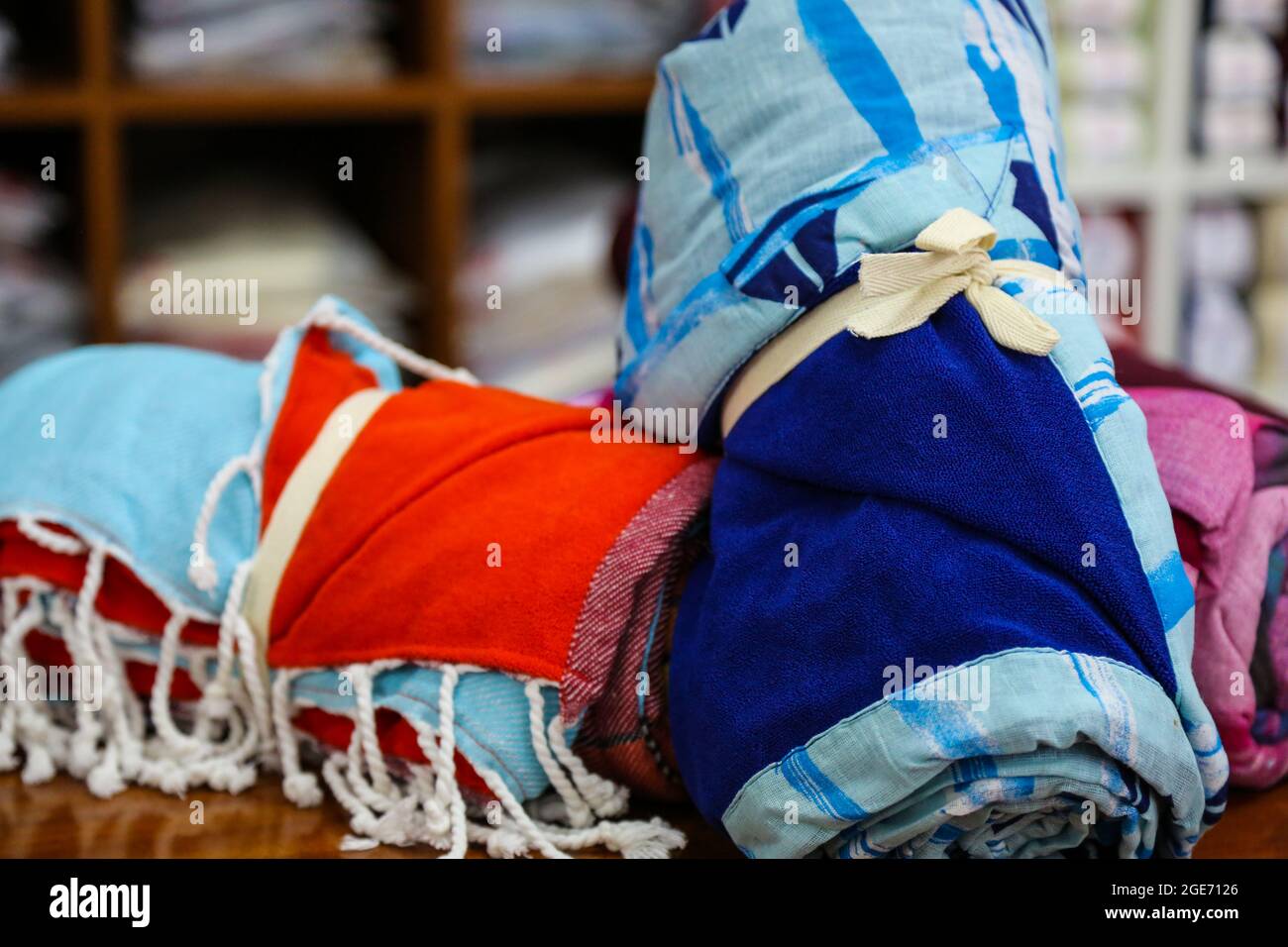 Towels of different colors folded and placed in a sample for sale Stock ...