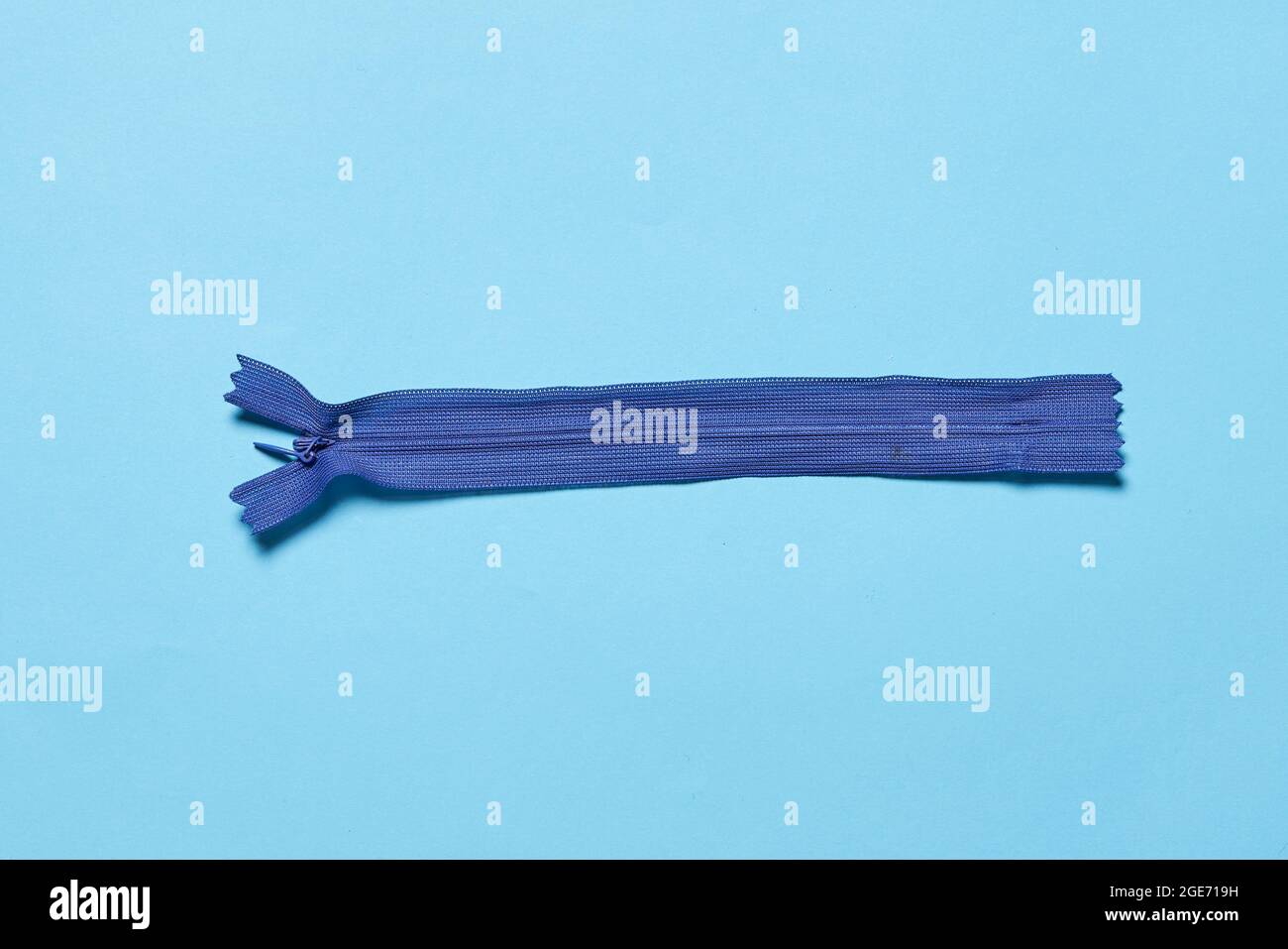 Blue sewing zipper on blue. Zipper stripe with slider pattern for ...
