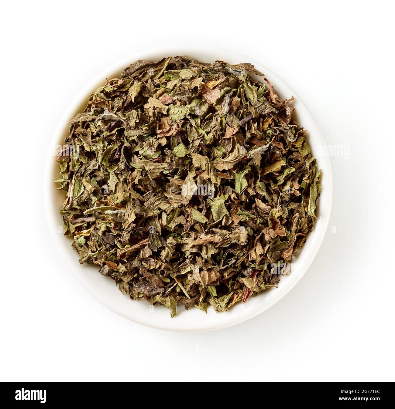 White bowl of dried peppermint tea isolated on white background; top ...