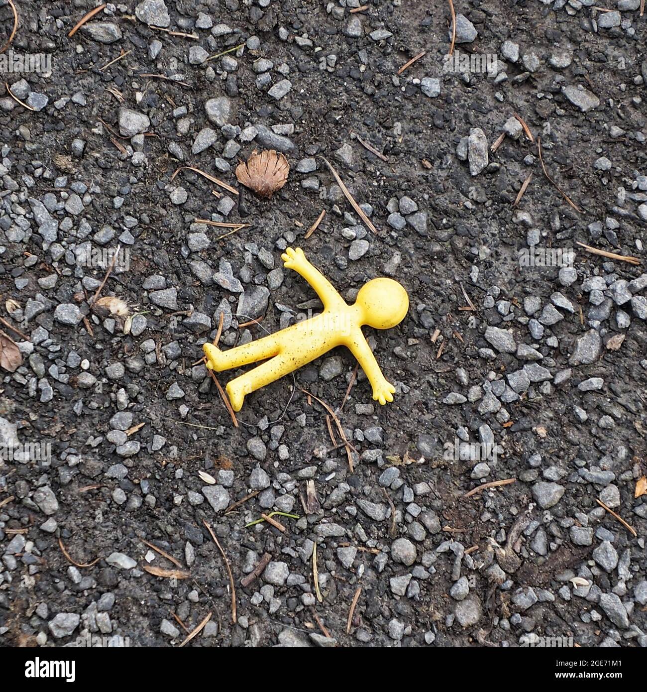 Toy Man on ground Stock Photo - Alamy