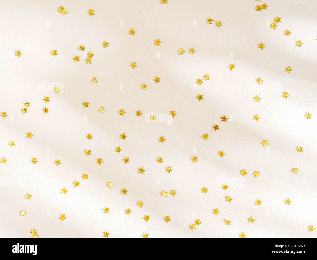 Party shiny decoration pattern - golden stars in the form of confetti ...
