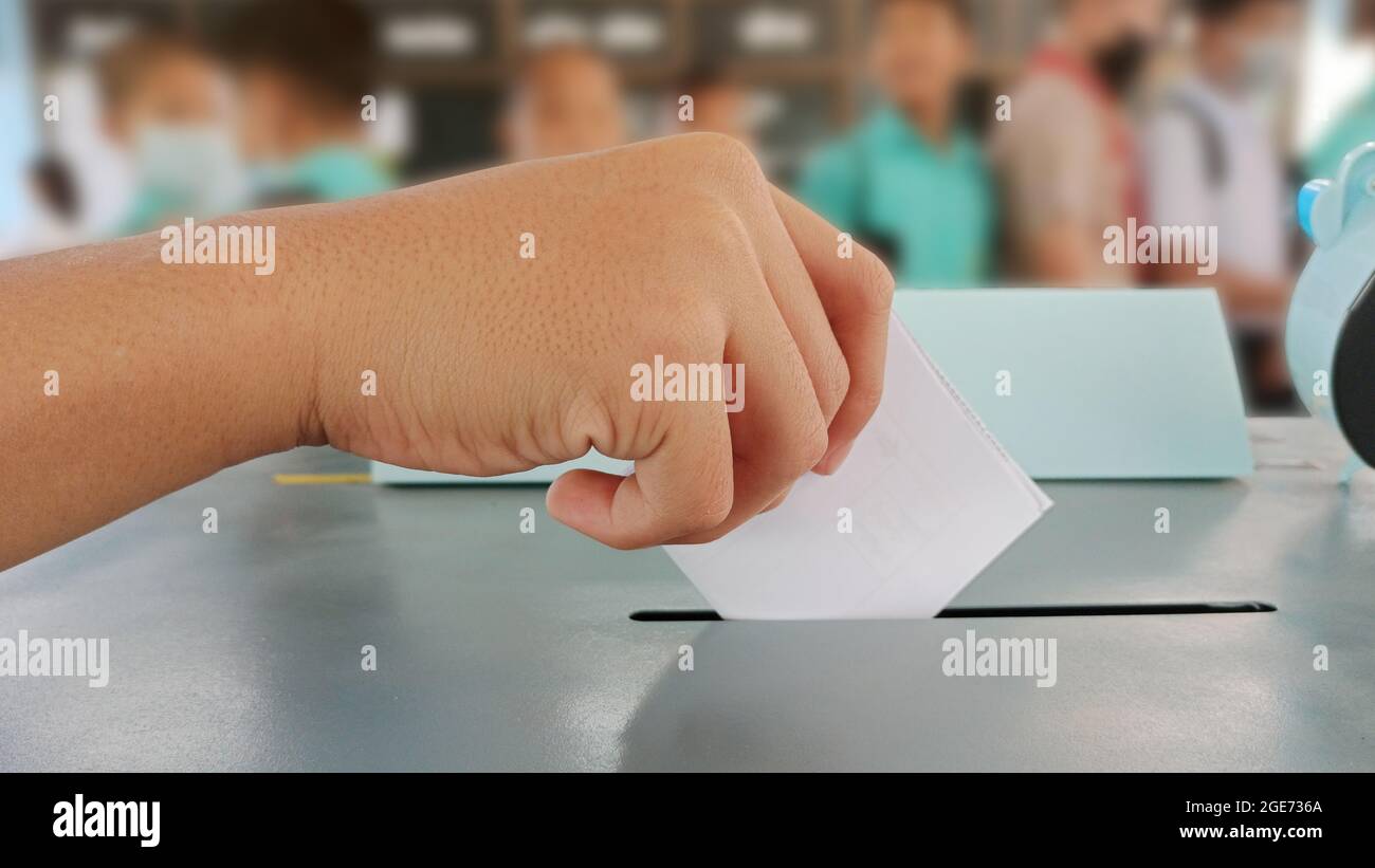 Student hands voting ballot box hi-res stock photography and images - Alamy
