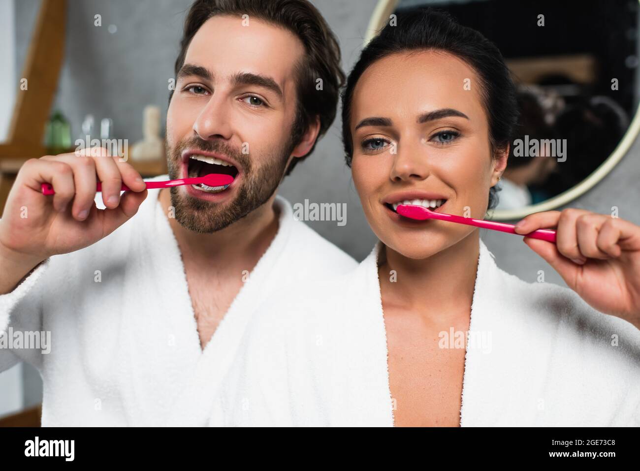 Happy young couple toothbrushes hi-res stock photography and images - Alamy
