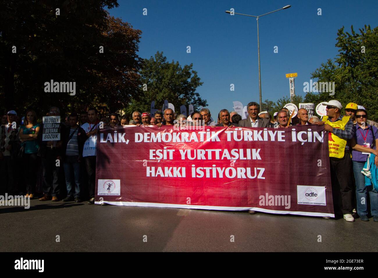 A banner reading "We want equal citizenship rights for a secular ...