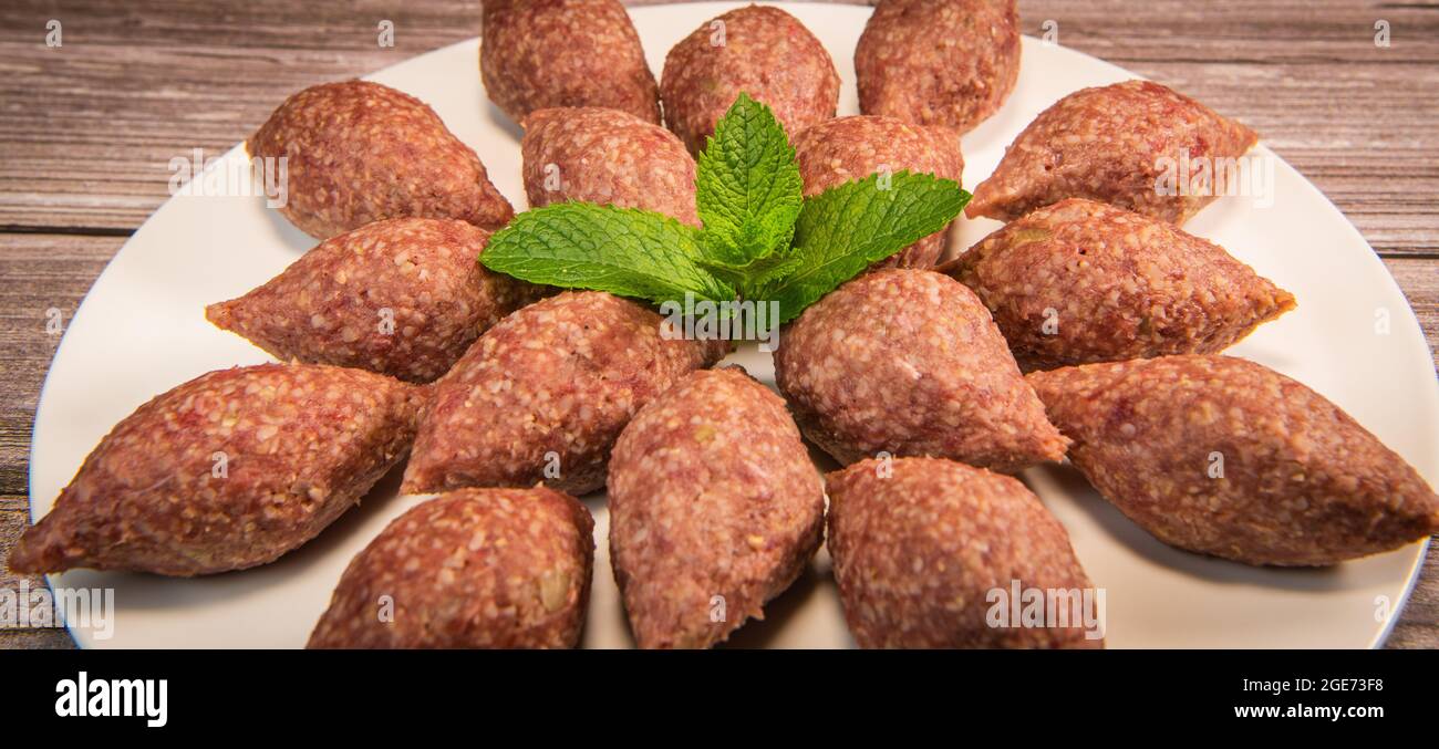 Traditional kebbe and pita bread on big round plate in lebanese ...
