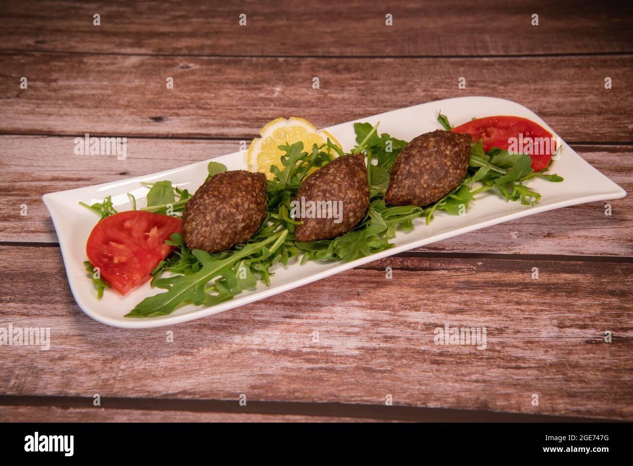 Traditional kebbe and pita bread on big round plate in lebanese ...
