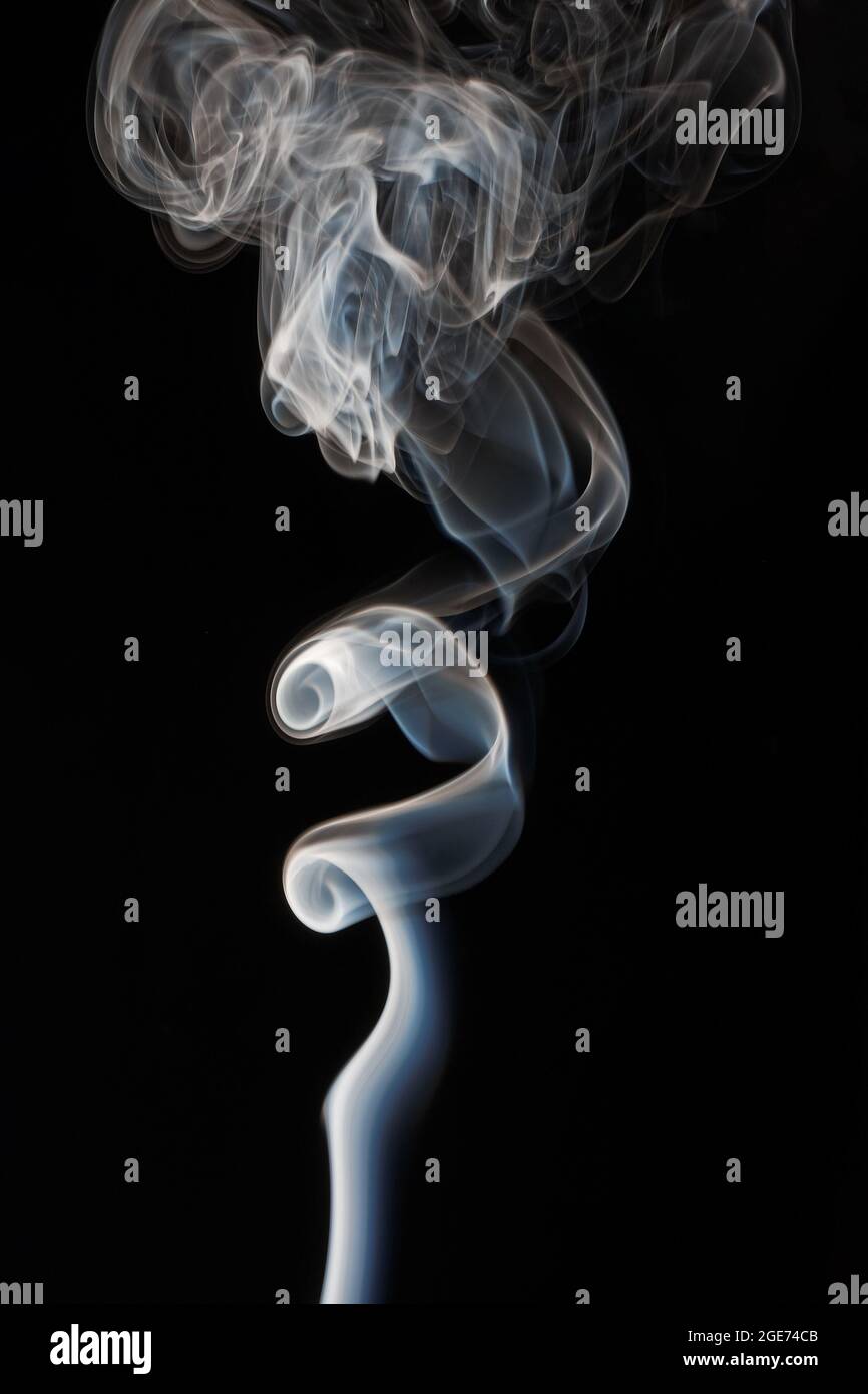Close up of smoke or steam rising against black background Stock Photo ...