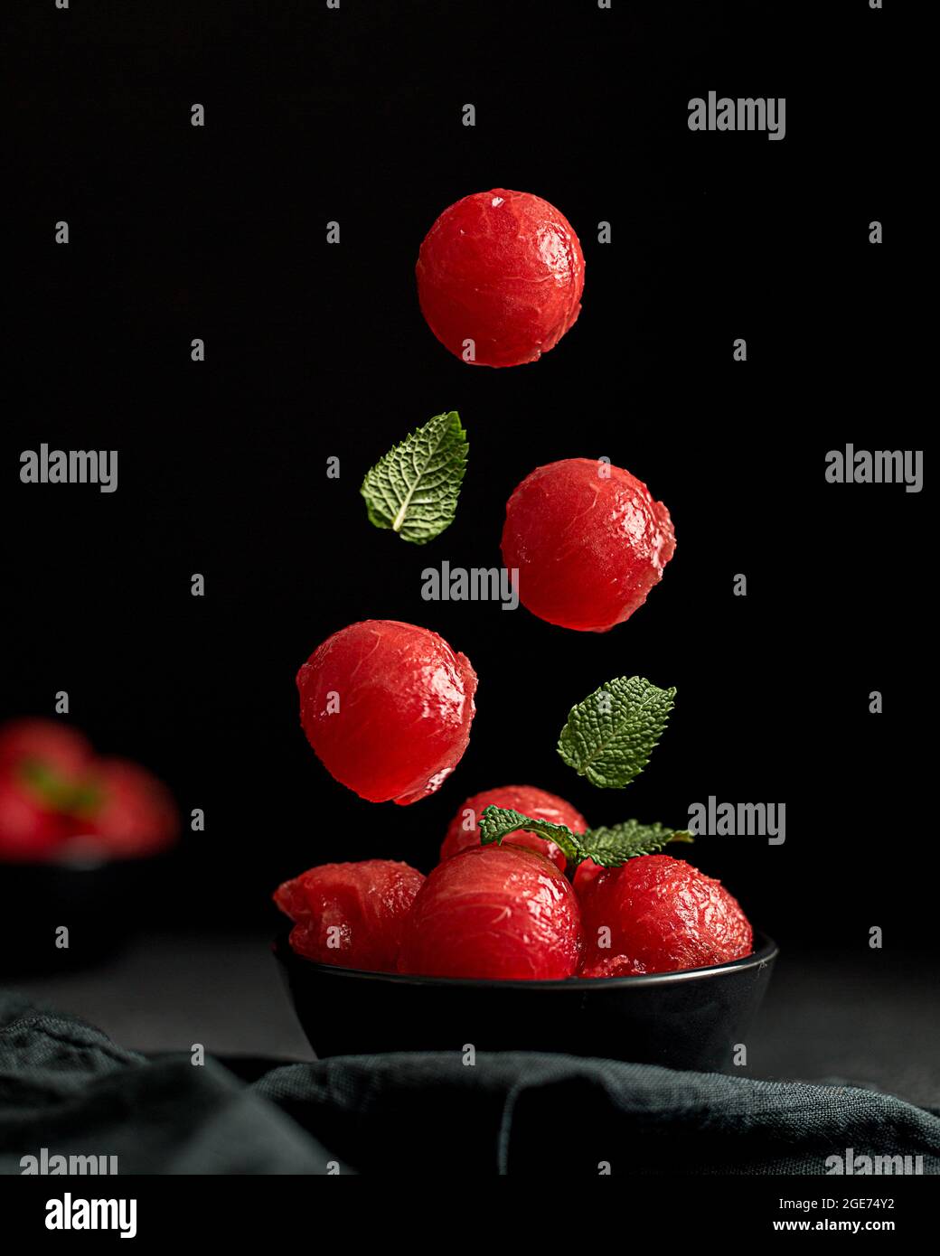 Creative concept with falling food on black backdrop Stock Photo - Alamy