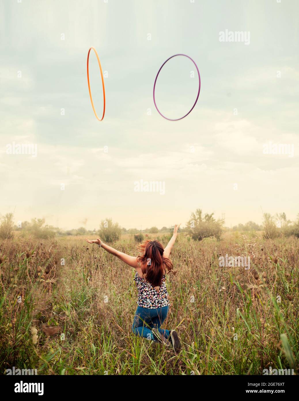 Woman hula hoop grass hi-res stock photography and images - Alamy